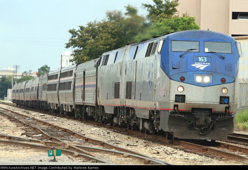 AMTK 163 heads southbound over some sad looking tracks